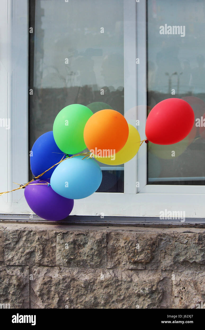 Multicolored balloons adorn the entrance to the cafe Stock Photo - Alamy