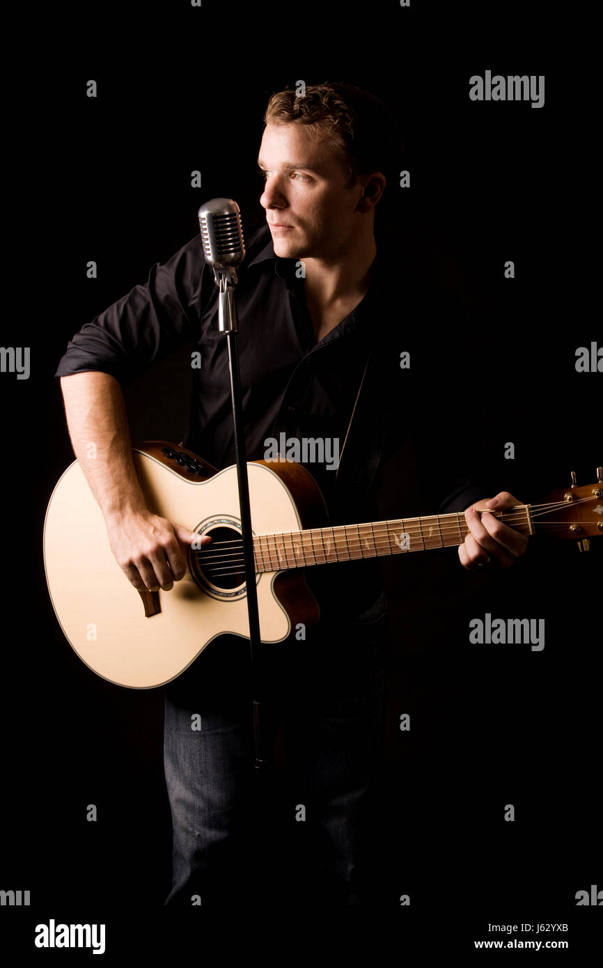 music musician guitar acoustic young younger man humans human beings ...