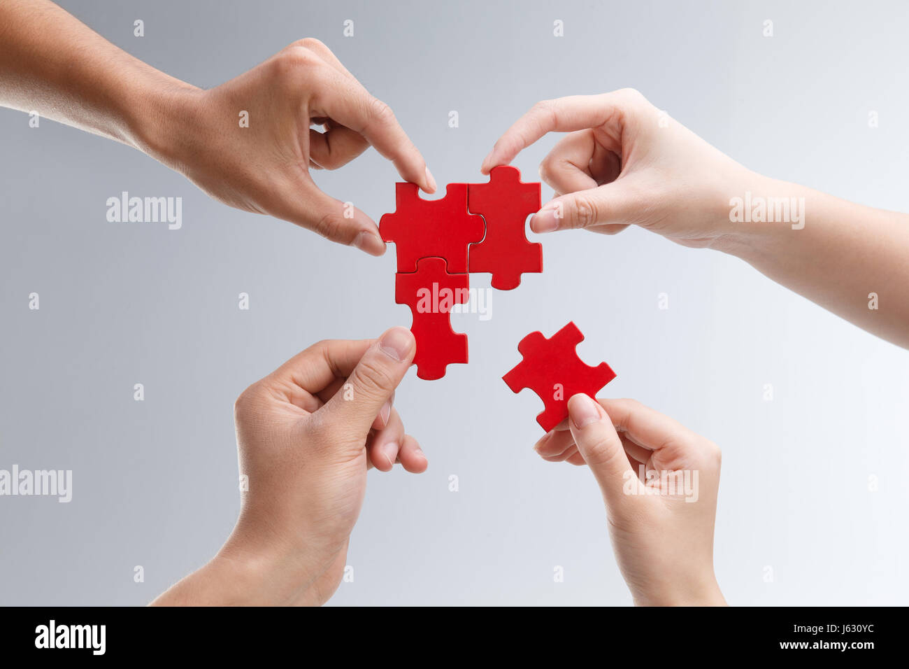 The hand holding the puzzle Stock Photo - Alamy