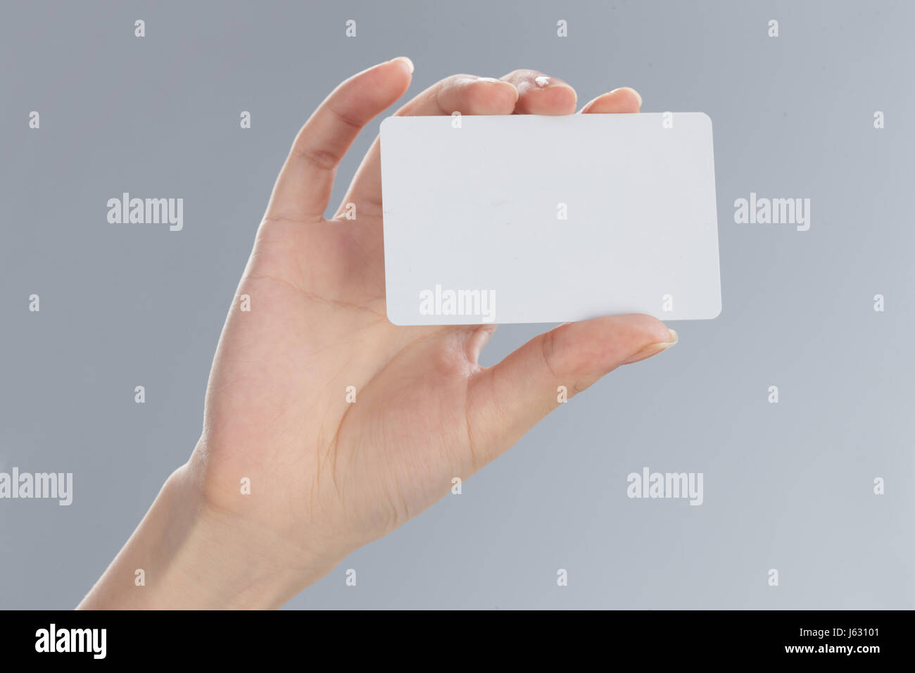 The hand holding the card Stock Photo - Alamy