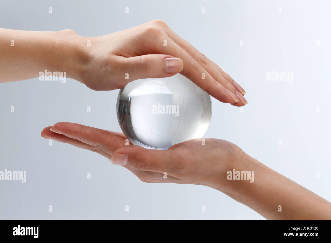 The hand holding the crystal ball Stock Photo - Alamy