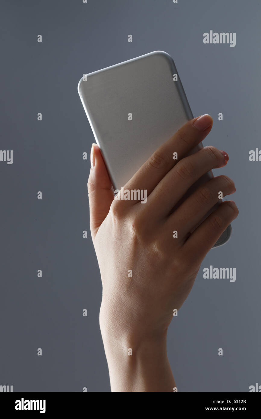 Hand holding mobile phone Stock Photo - Alamy