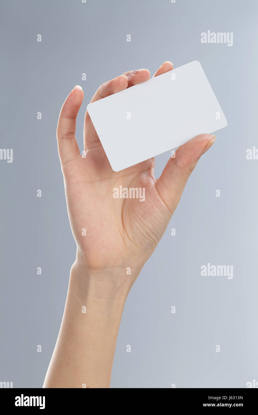 The hand holding the card Stock Photo - Alamy