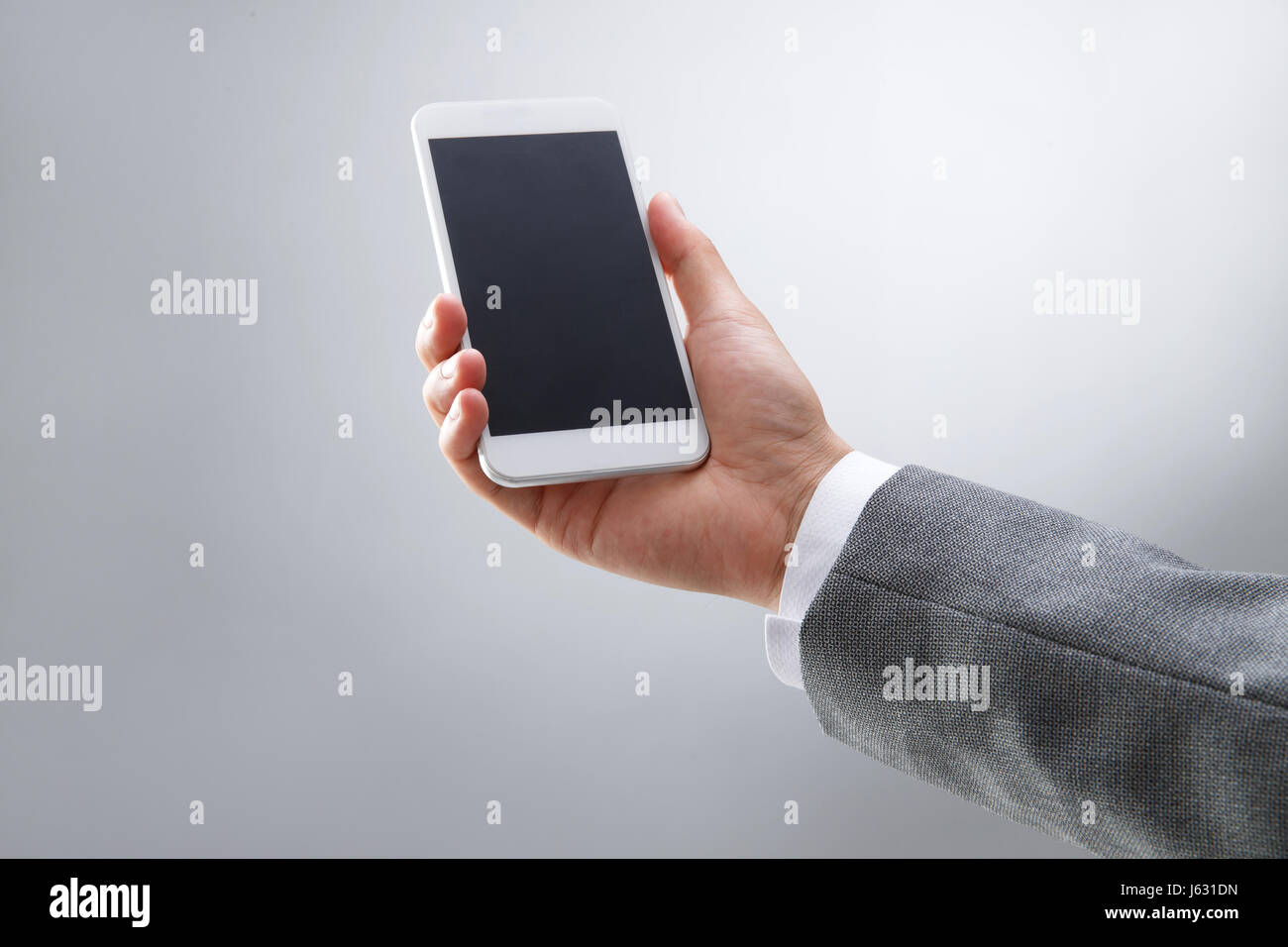 Hand holding mobile phone Stock Photo - Alamy