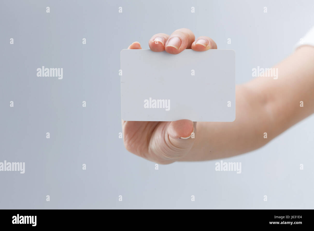 The hand holding the card Stock Photo - Alamy