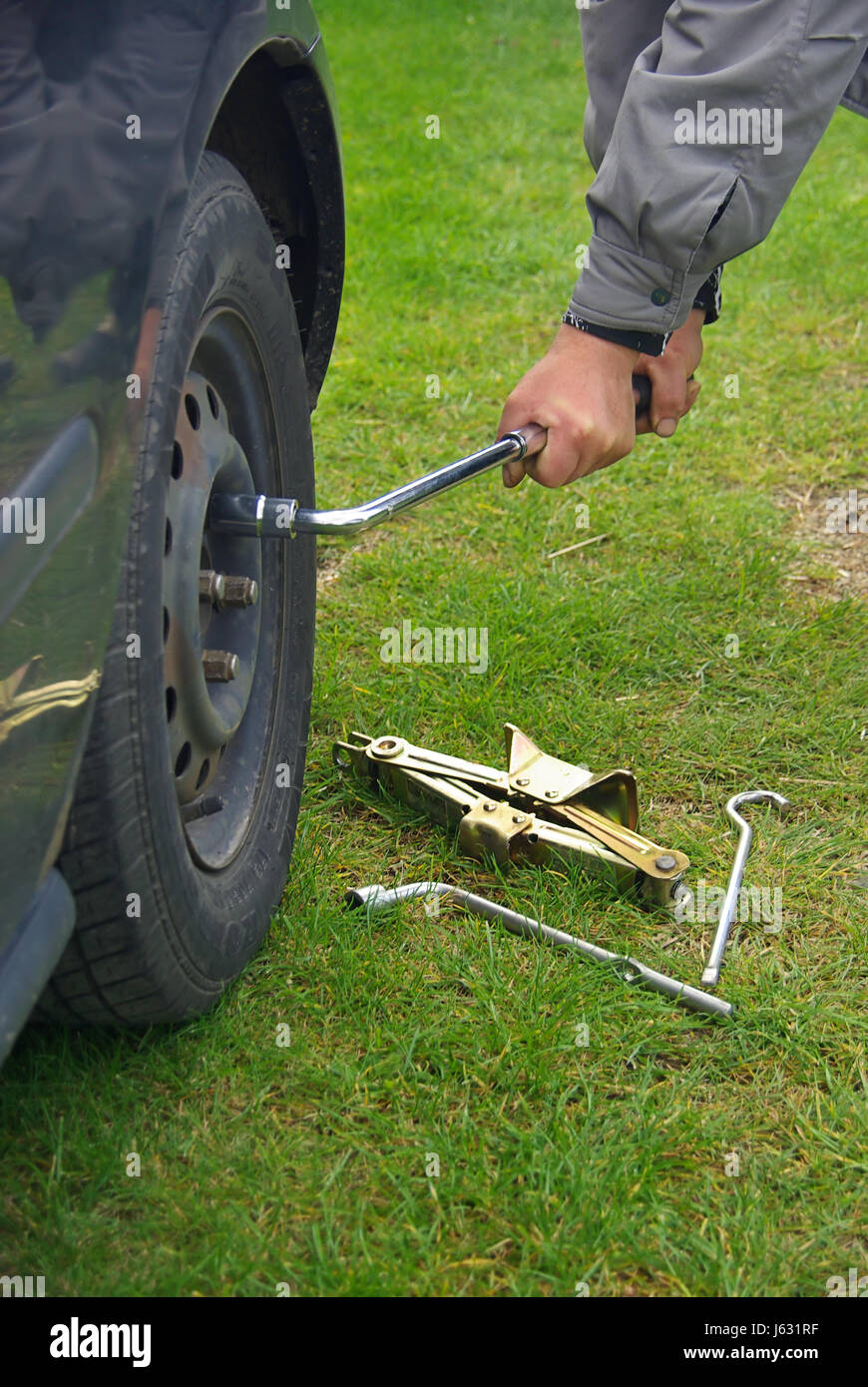 change wheel - change a tire 01 Stock Photo - Alamy