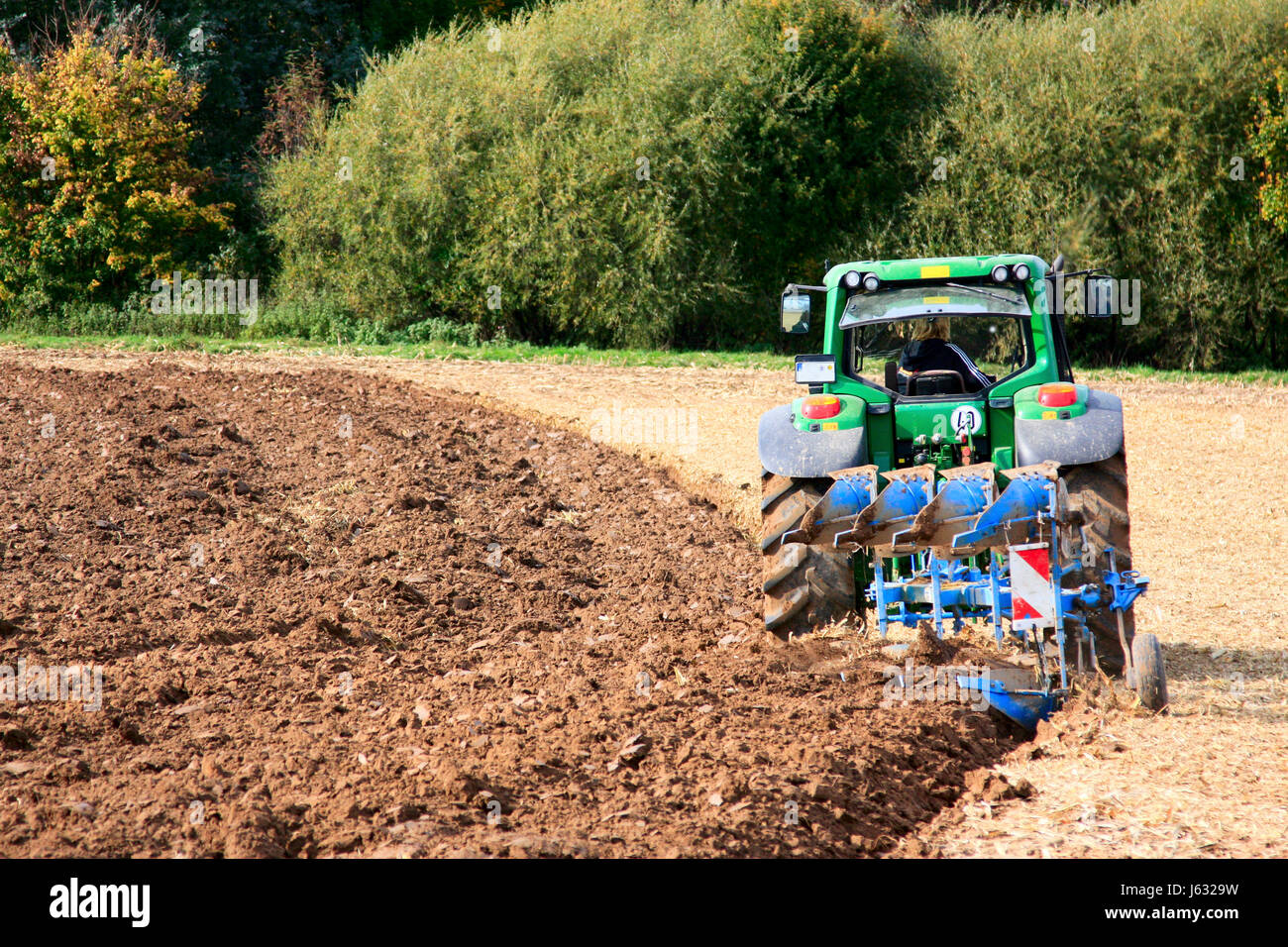 field acre tractor plough field work plowing blue agrarian colour ...