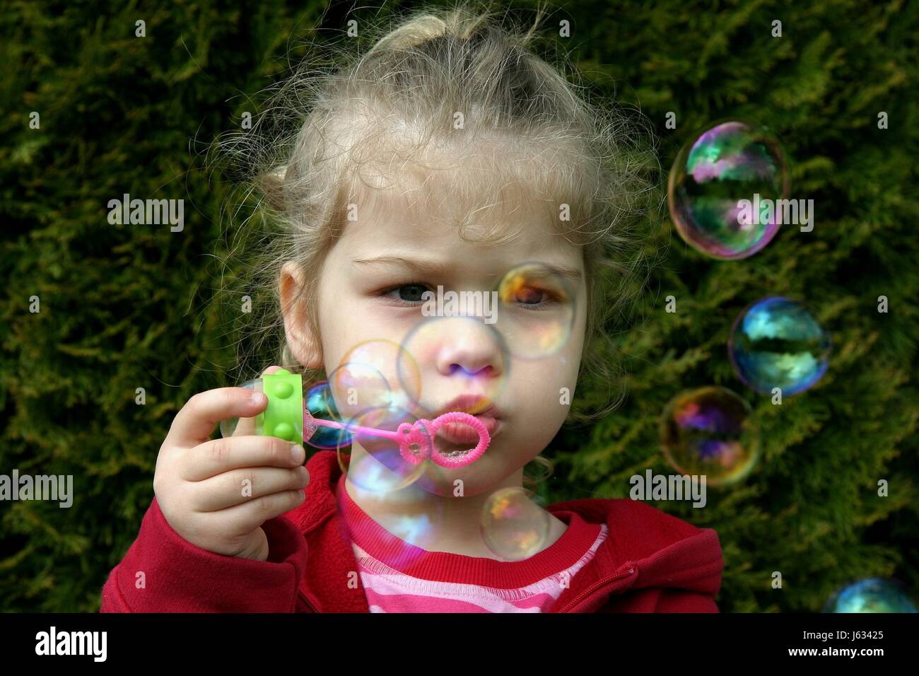 hand portrait hold entice soap bubbles child girl girls curls humans ...