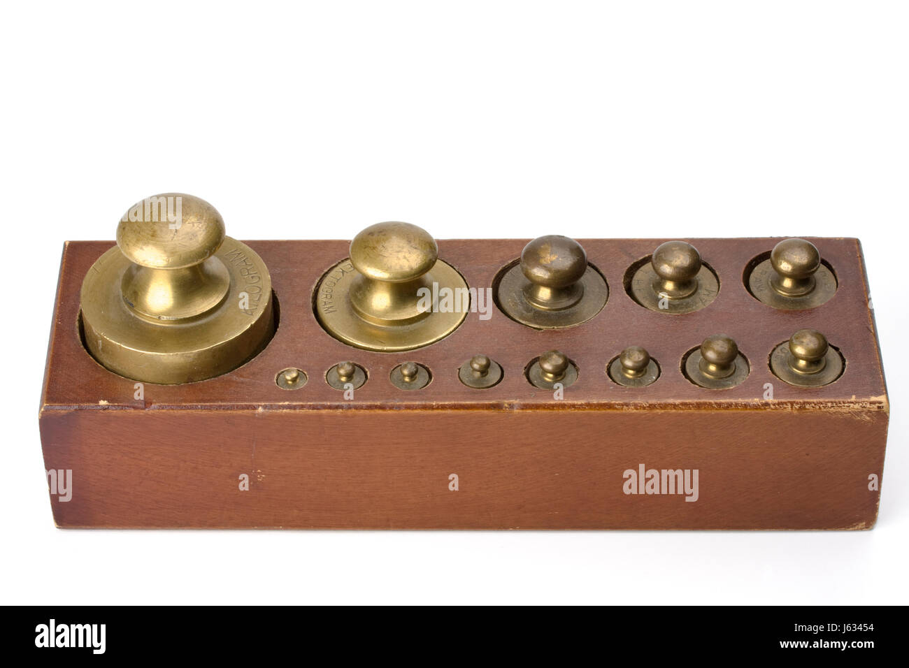 weights made of brass on a white background Stock Photo - Alamy