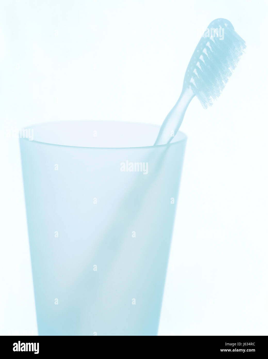 toothbrush in cup Stock Photo - Alamy