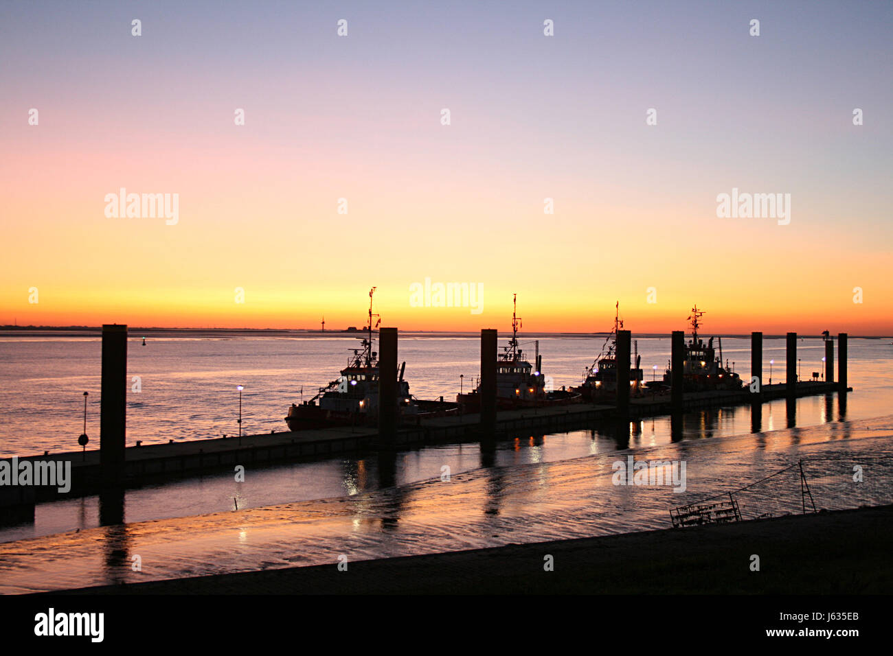 sunset dike tug salt water sea ocean water shine shines bright lucent ...