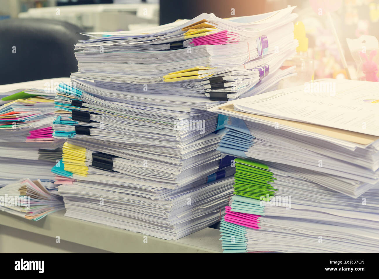 Pile of unfinished documents on office desk, Stack of business paper ...