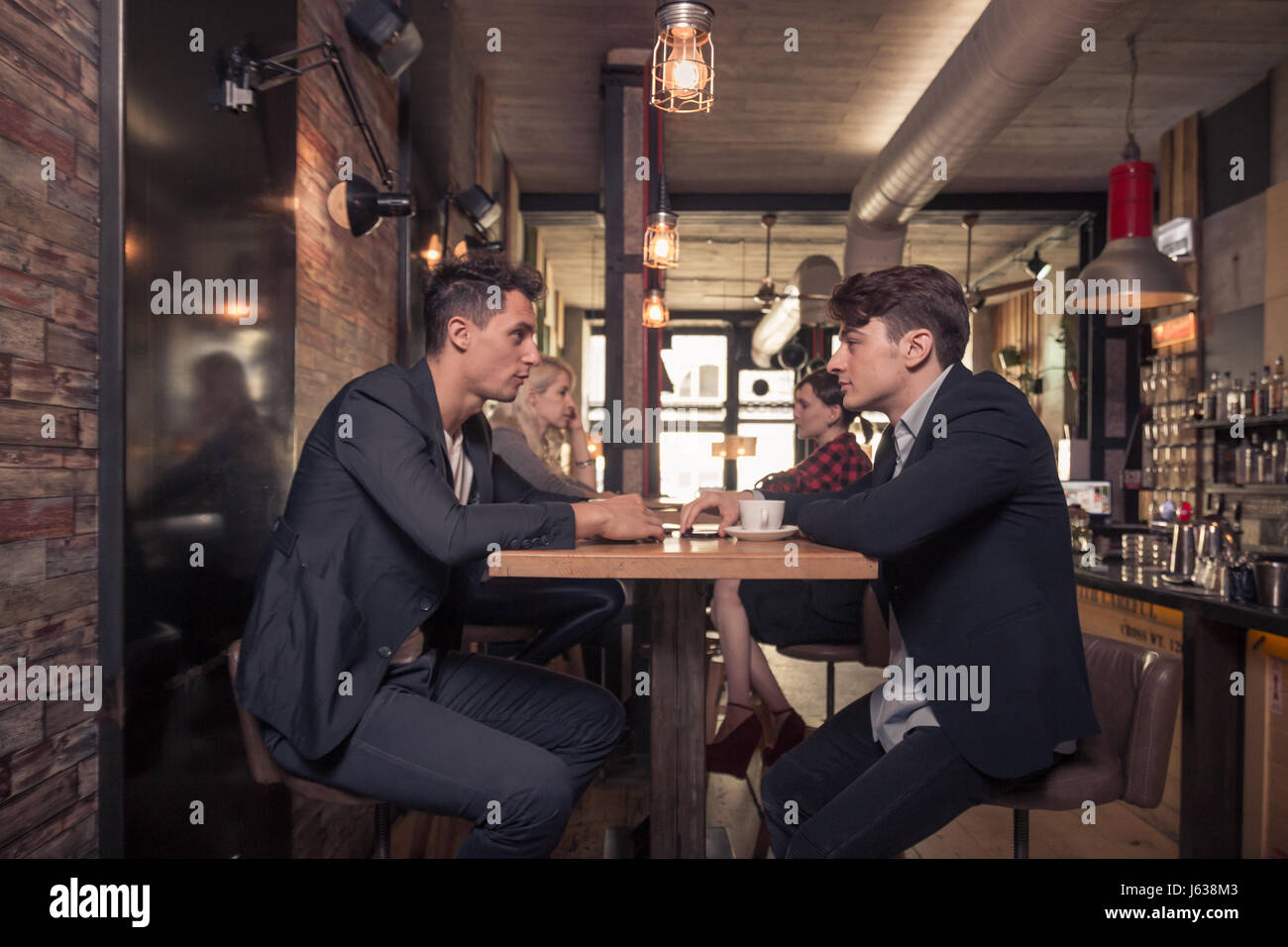 Four people talking hi-res stock photography and images - Alamy