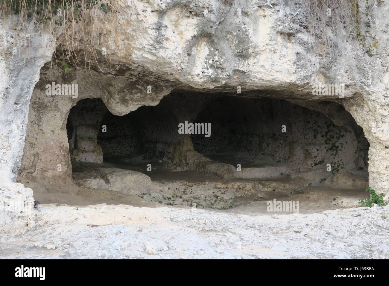 A niche cut into the rock above the ancient Greek theatre at Temenites ...