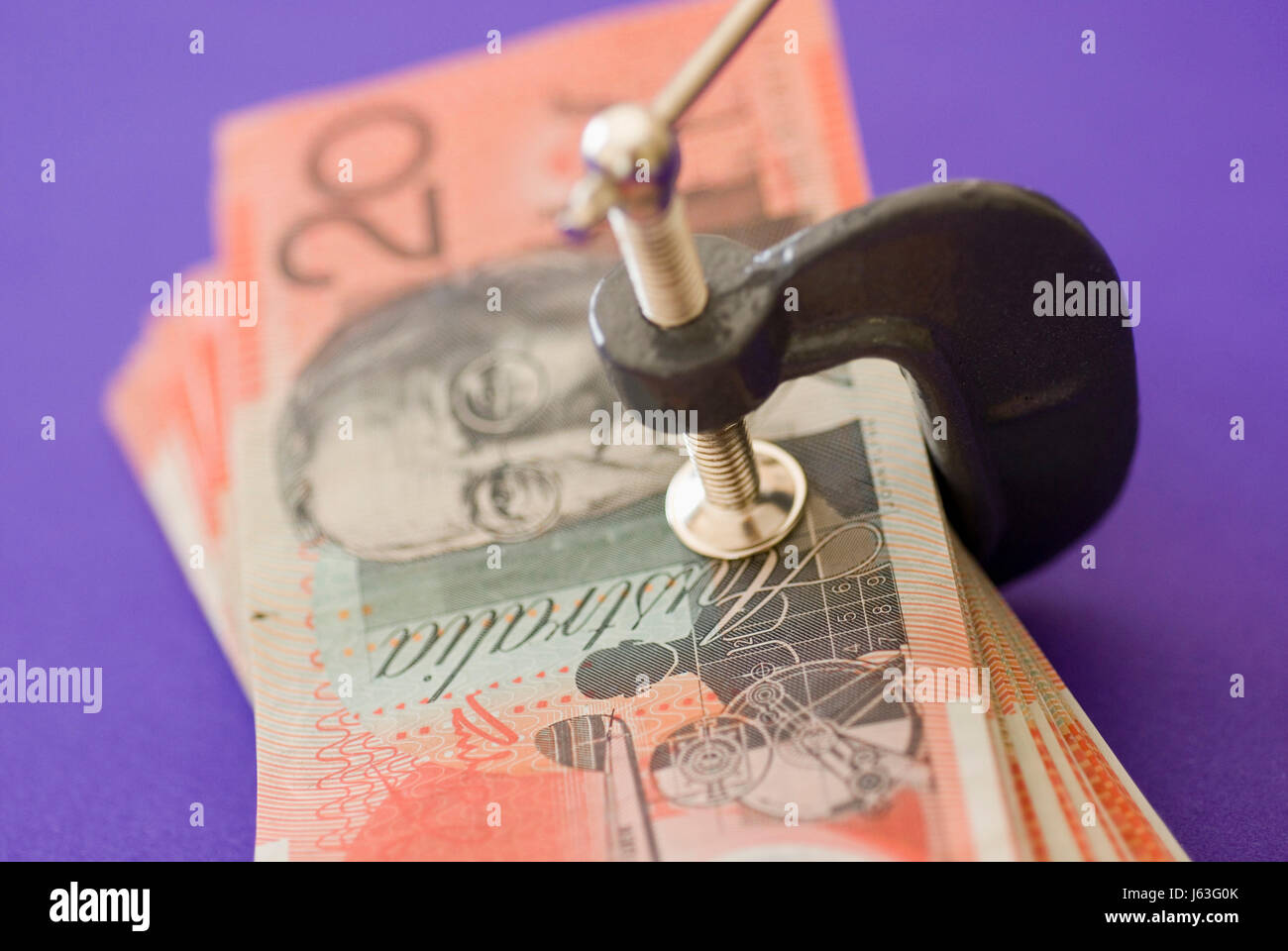 finance squeeze spending expense money bruise dollar dollars currency ...