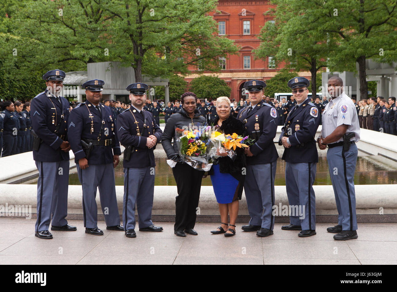 Prince Georges County Police officers and family of fallen officers pose for a group photo in ...