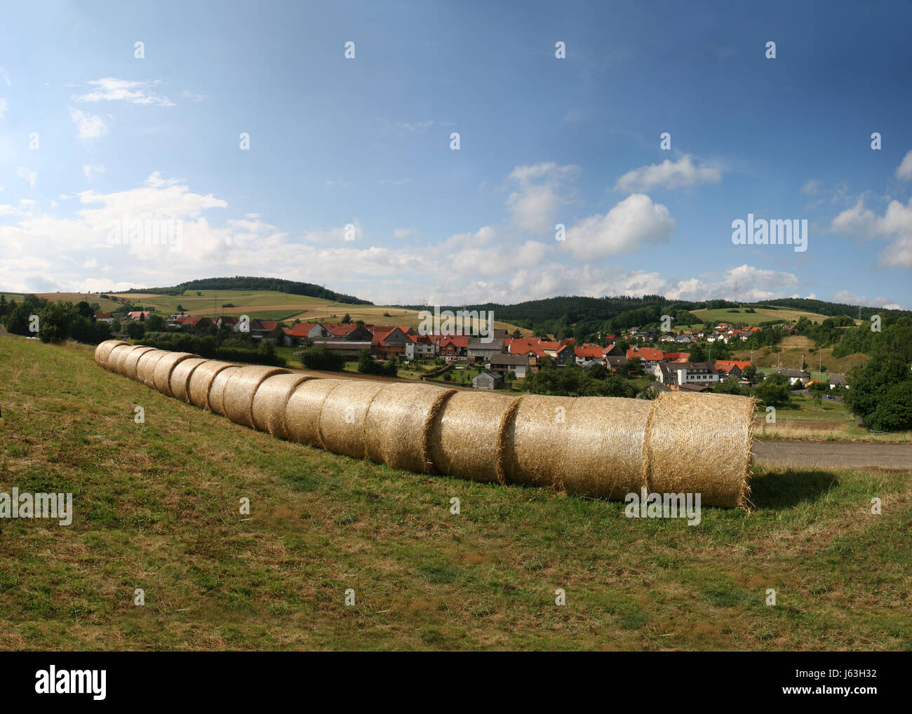 bale before village in knll (north hessen Stock Photo - Alamy