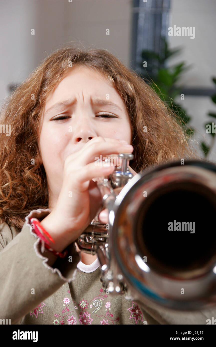 blow frontally effort intense girl girls trumpet laugh laughs laughing ...