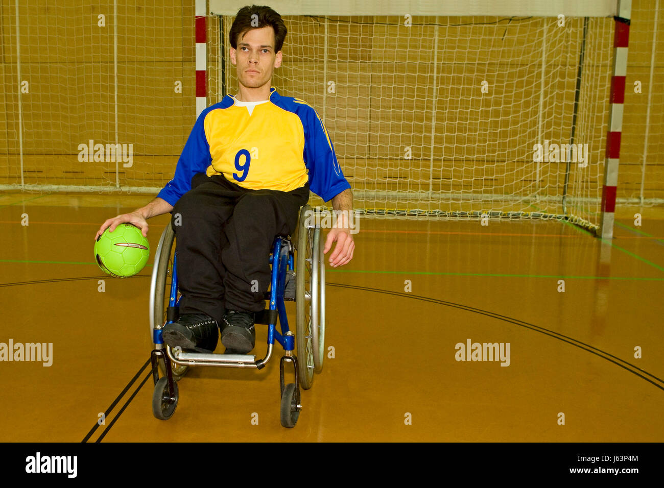 disabled sports in wheelchair,handball Stock Photo - Alamy