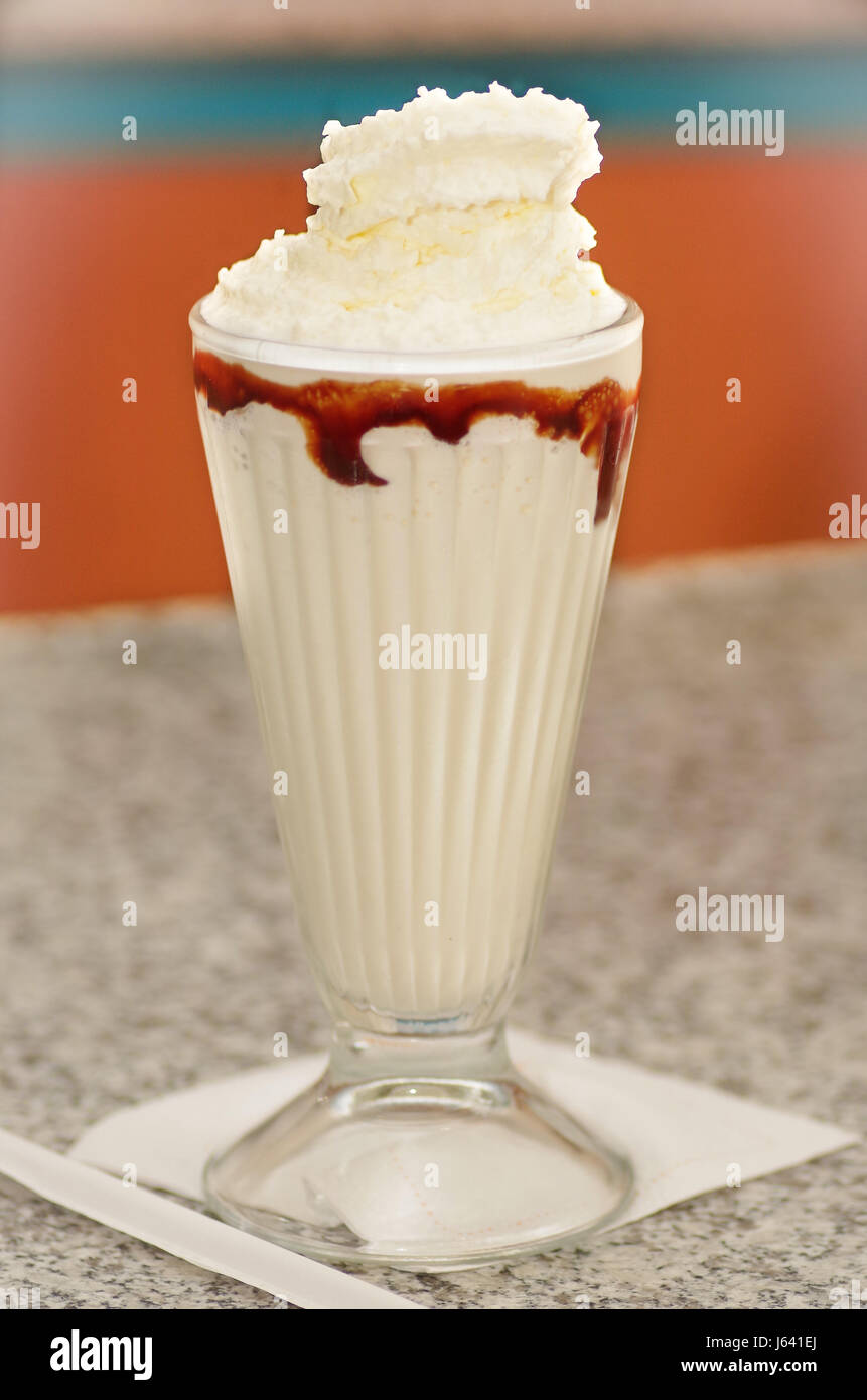 Delicious vanilla milkshake with syrup and cream on top Stock Photo - Alamy