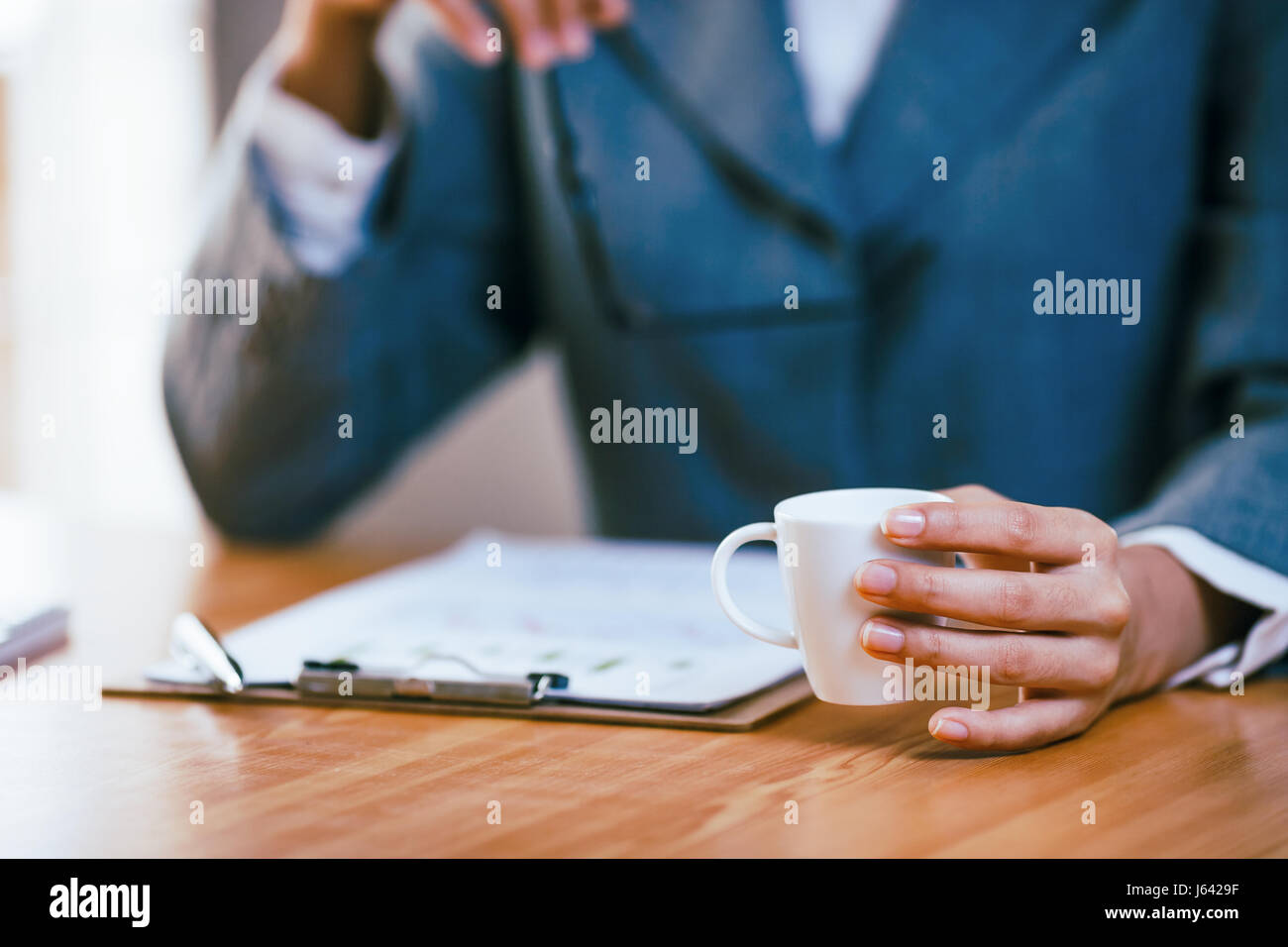 A hardworking business people work in the office and drinking coffee ...