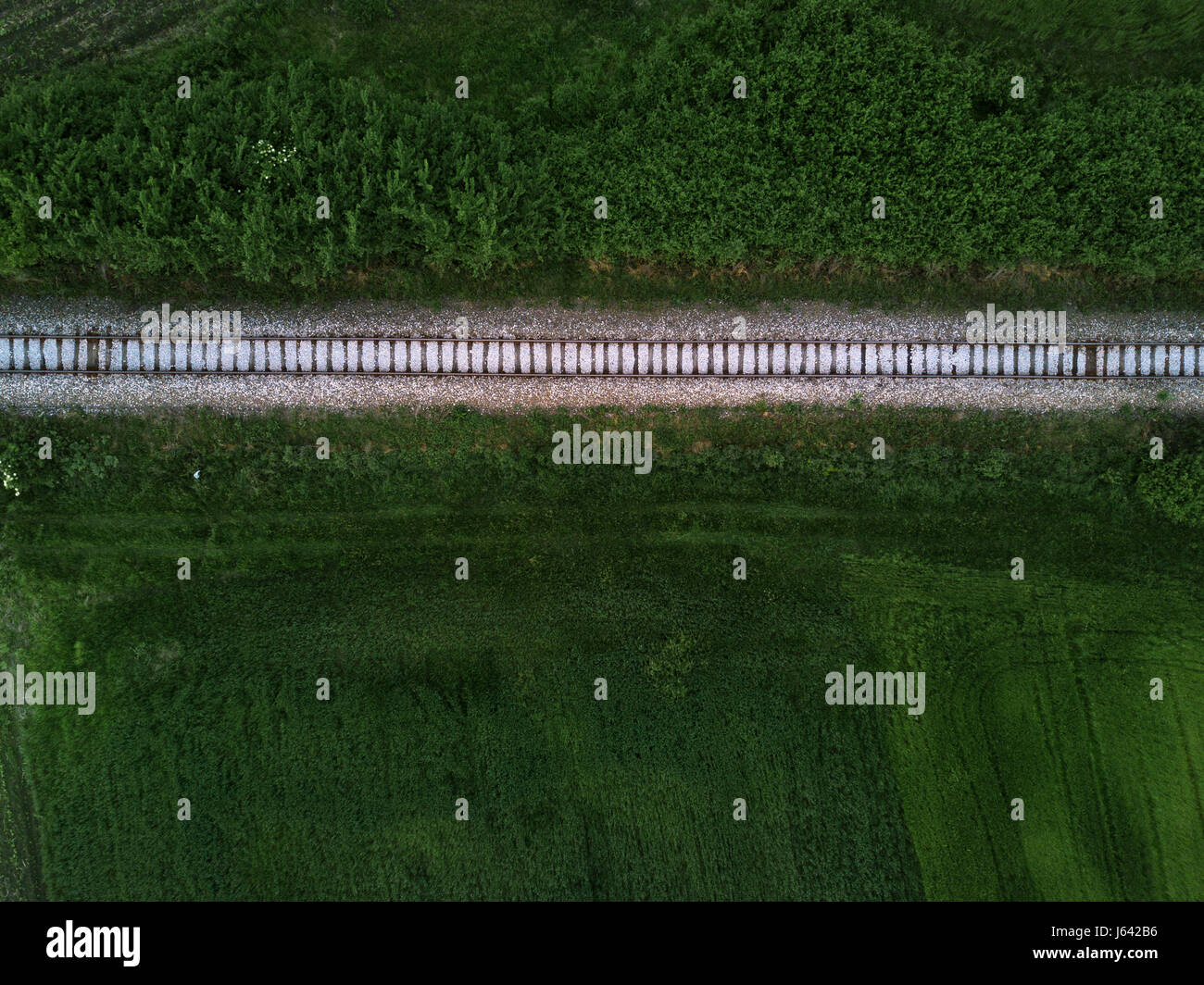 Aerial view of railway track through countryside, drone top view pov of ...