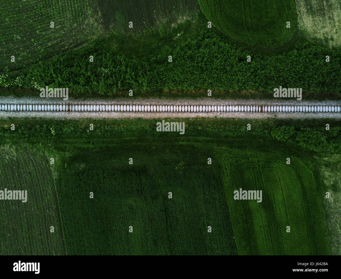Aerial view of railway track through countryside, drone top view pov of ...
