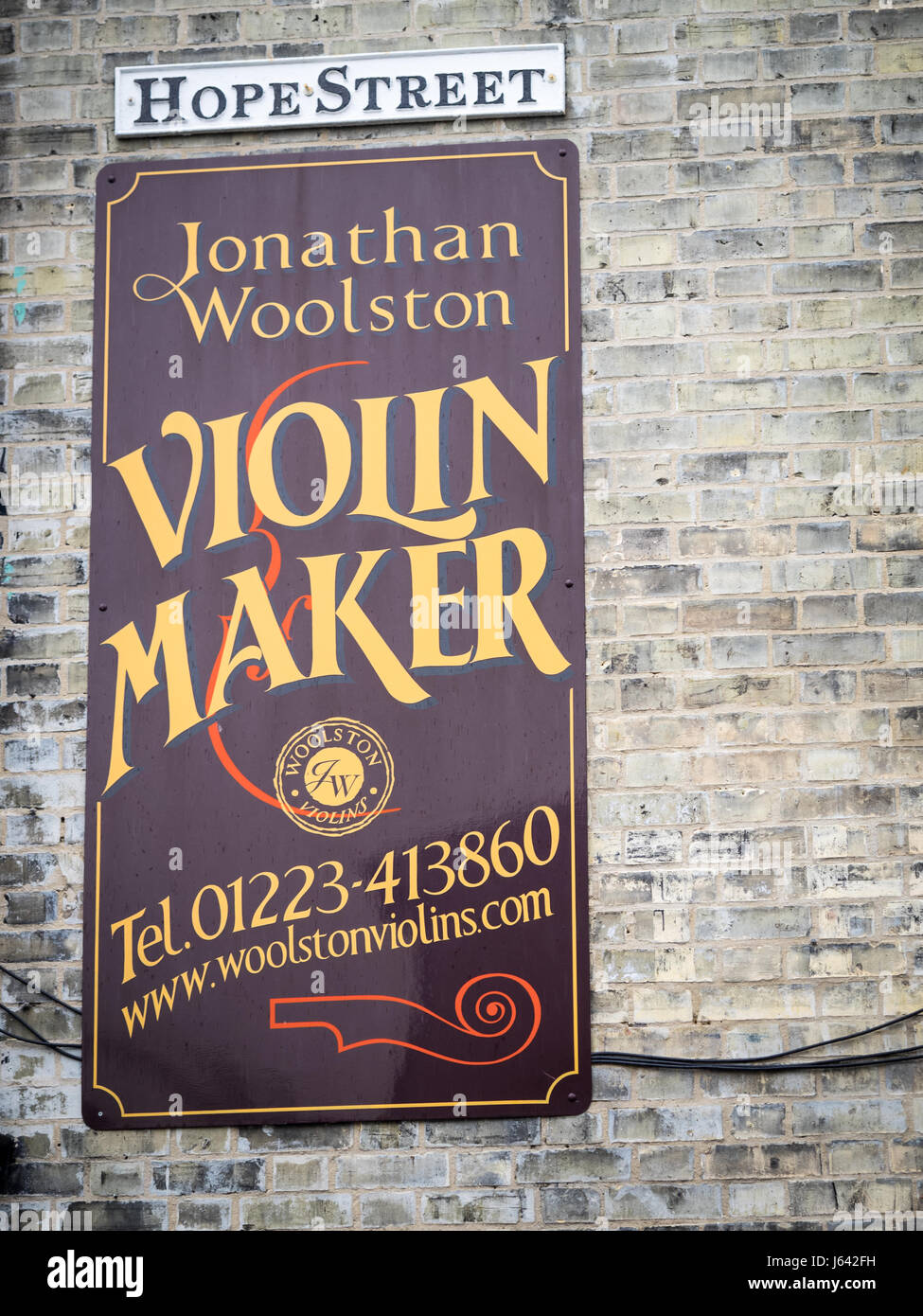 Signs outside the workshop of Jonathan Woolston, Violin Maker, in Mill ...