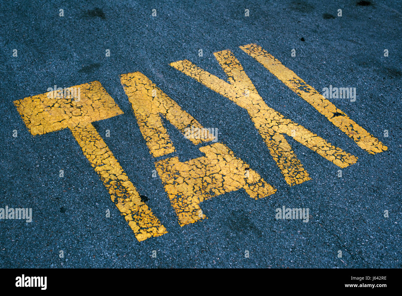Taxi stand sign on asphalt parking lot Stock Photo - Alamy