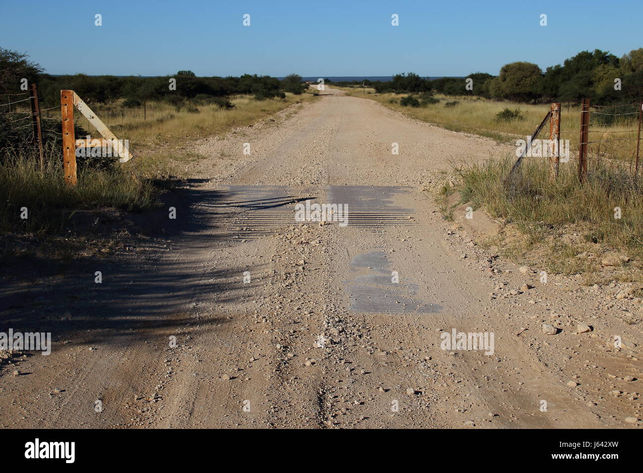 A long and dusty road winds through the countryside Stock Photo - Alamy