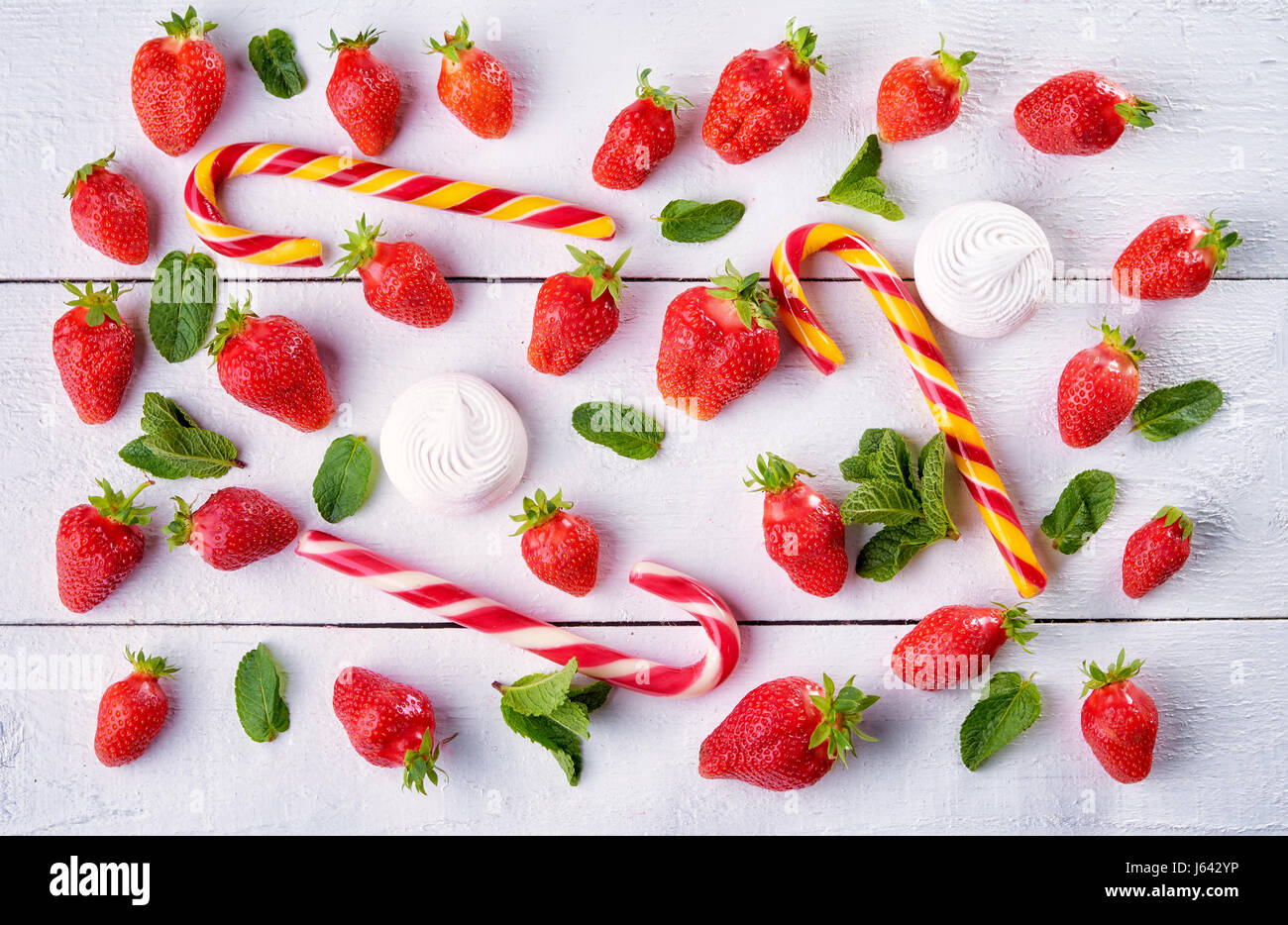 Colorful sweet fruit mix of strawberry, caramel marshmallows and green ...