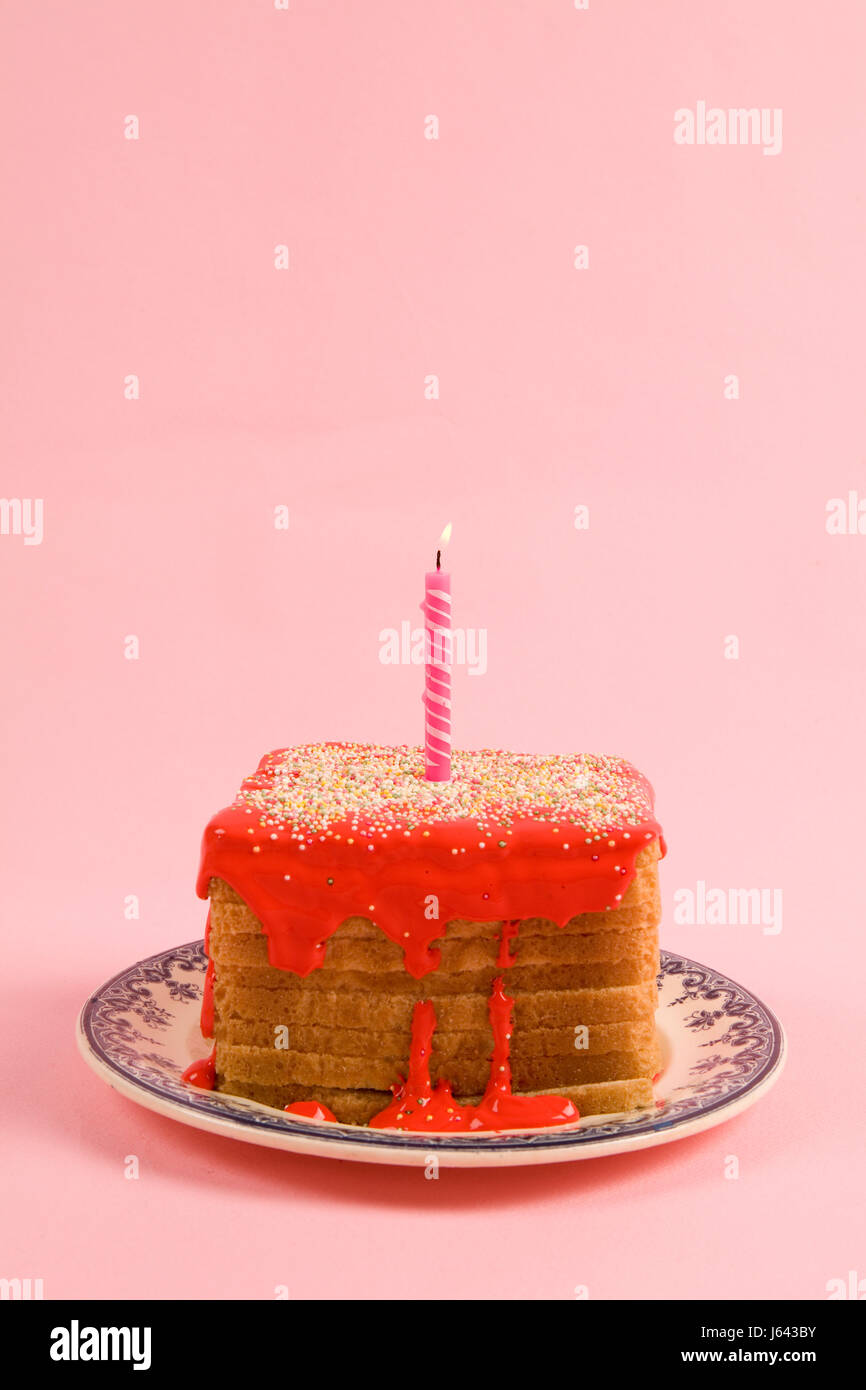 a quirky icing birthday bread covered with sprinkles and red coulis on ...