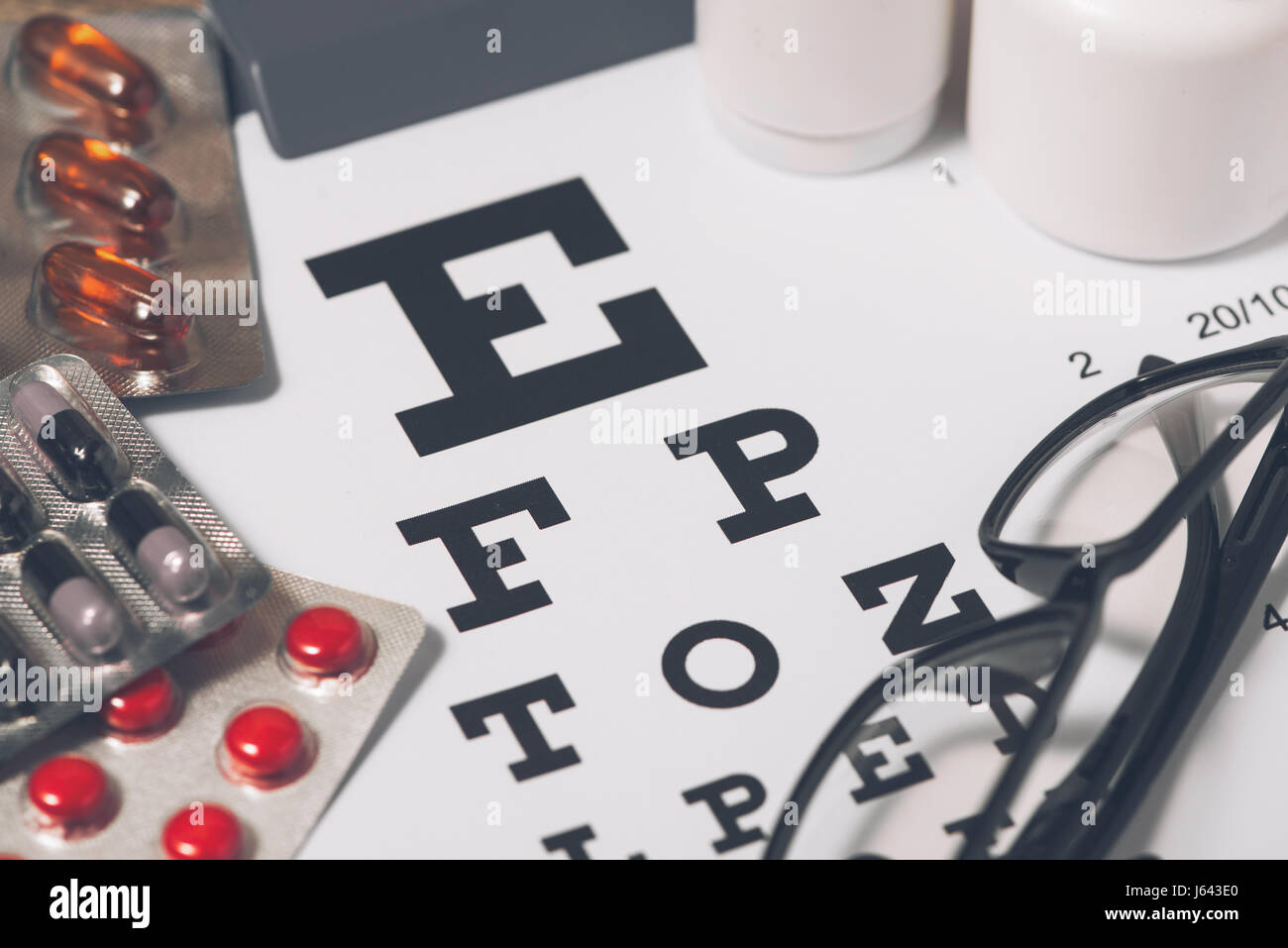 Healthy eyes. Eye chart and medicine Stock Photo - Alamy