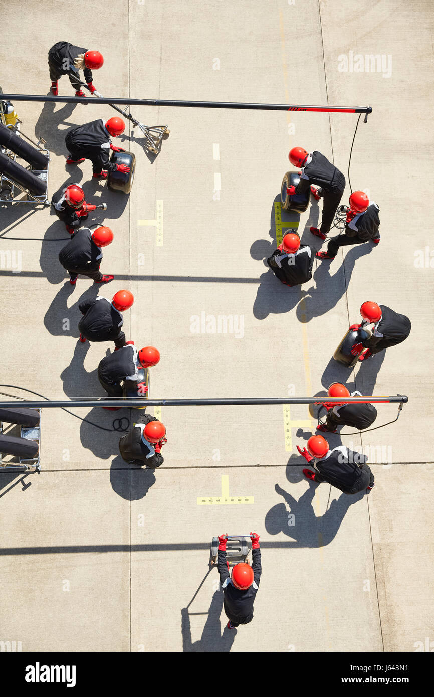 Overhead formula one pit crew ready at pit stop Stock Photo - Alamy