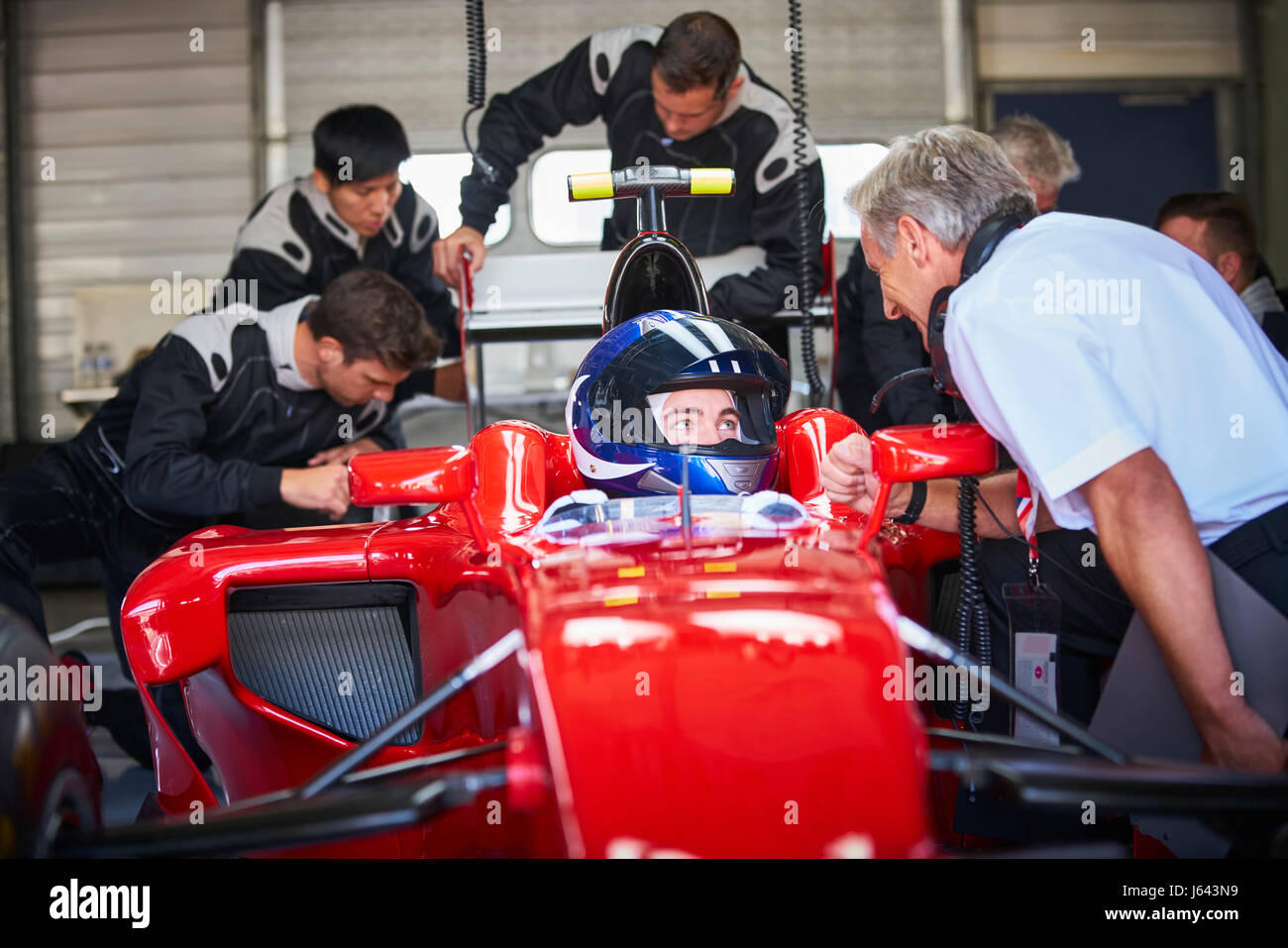 Garage talking team helmet f1 hi-res stock photography and images - Alamy