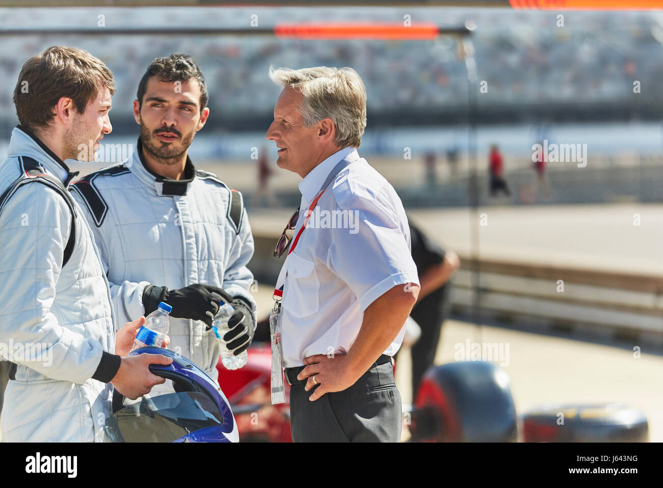Race car drivers talking hi-res stock photography and images - Alamy