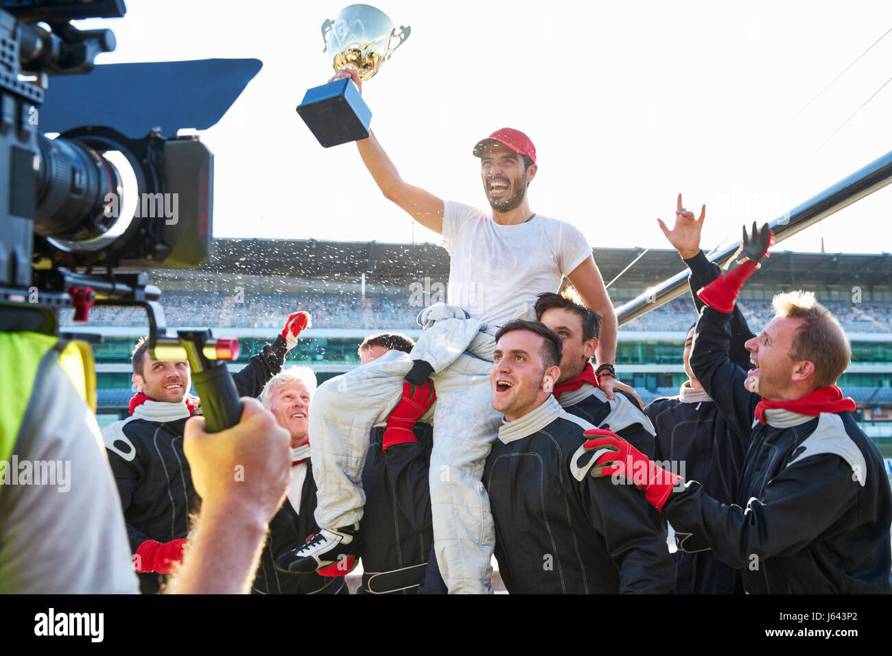 Racing team with trophy hi-res stock photography and images - Alamy