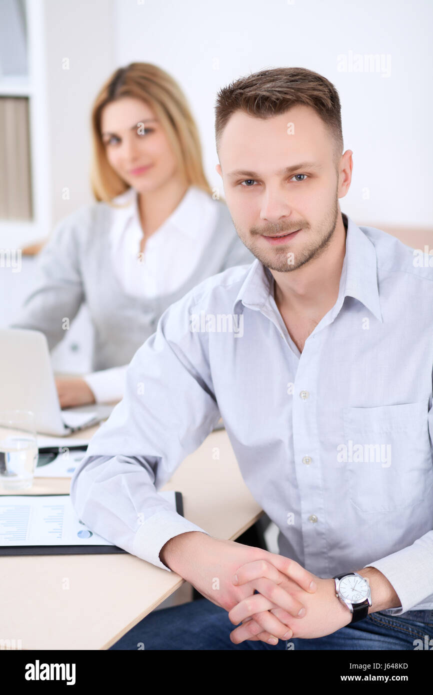 Two successful business partners working at meeting in office. Focus on ...