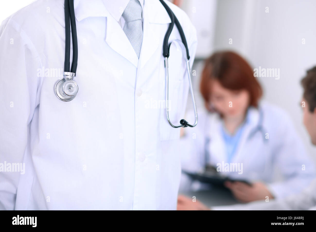 Close-up of a male doctor in a background of patient Stock Photo - Alamy