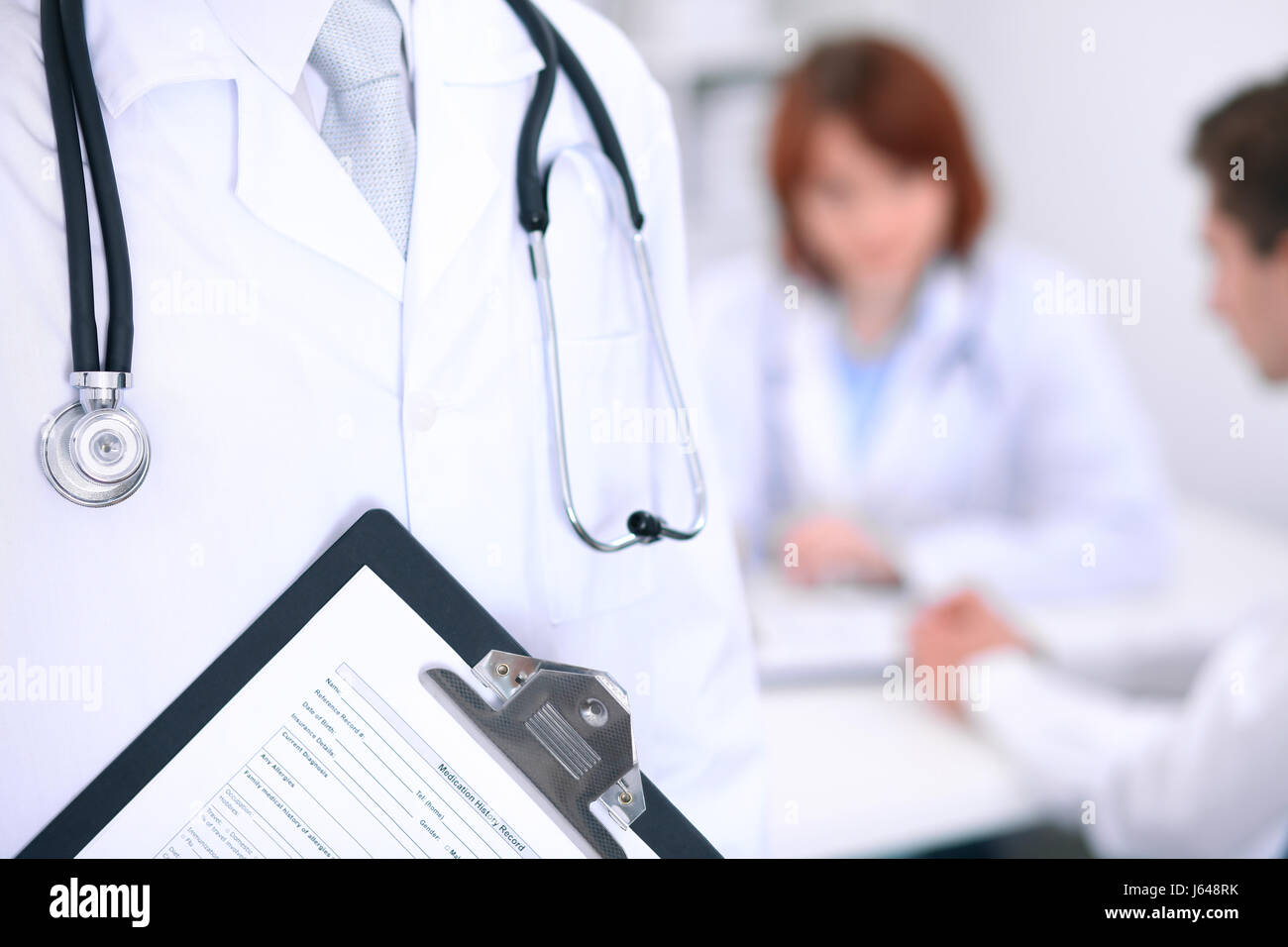 Close-up of a male doctor in a background of patient Stock Photo - Alamy