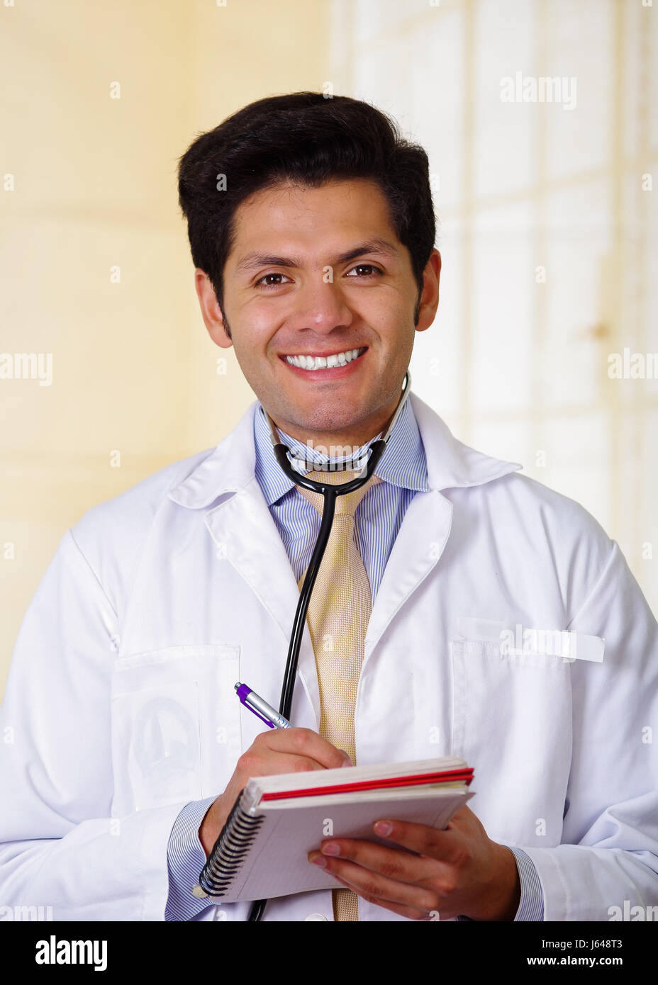 Handsome smiling doctor with an Stethoscope holding from his neck ...