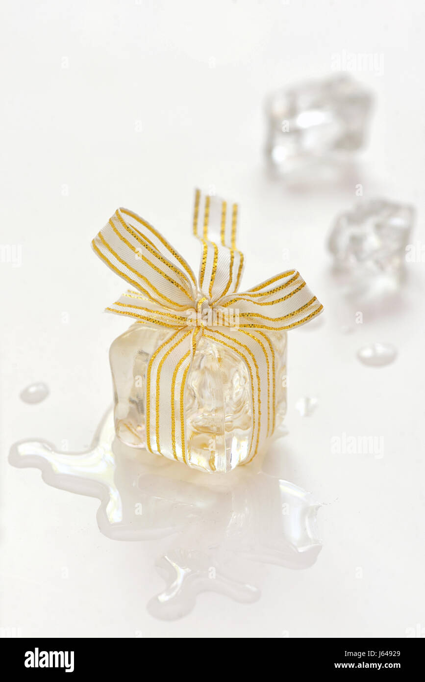 Melting ice cube gift Stock Photo - Alamy