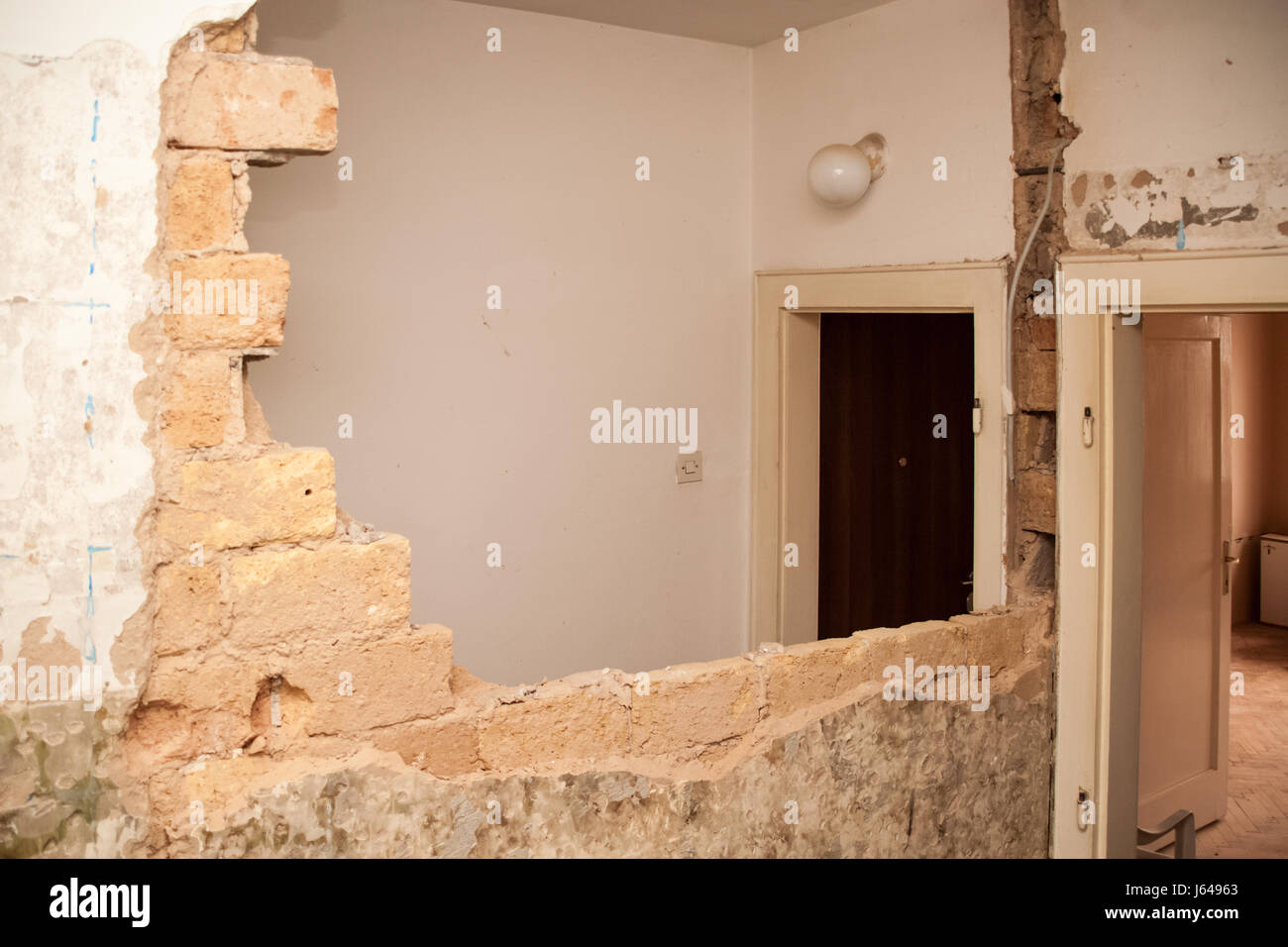 Flat renovation, demolition of the partition wall to create a single ...