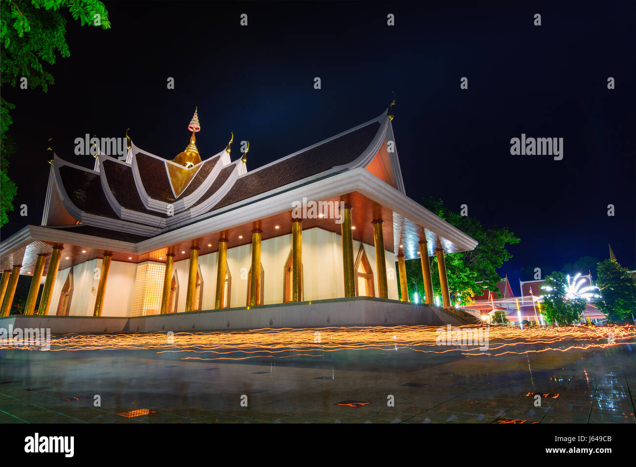 Candle lights from people walk around church in Visakha Puja Day at Pa ...