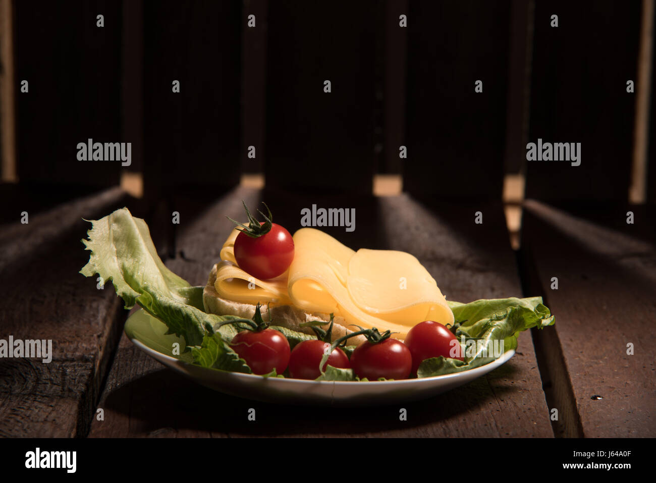 Swiss yellow cheese sandwich with cherry tomtoes Stock Photo - Alamy