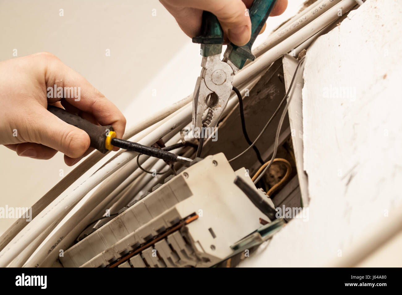 Flat renovation, handyman, electrician, trying to connect all the wires ...