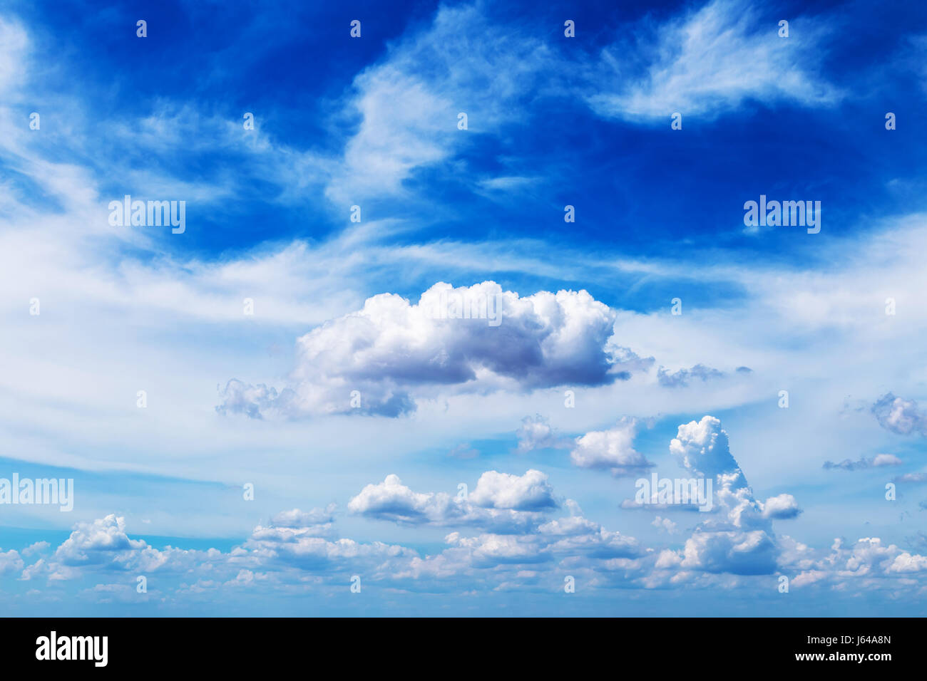 Clouds in the sky on a clear day Stock Photo - Alamy