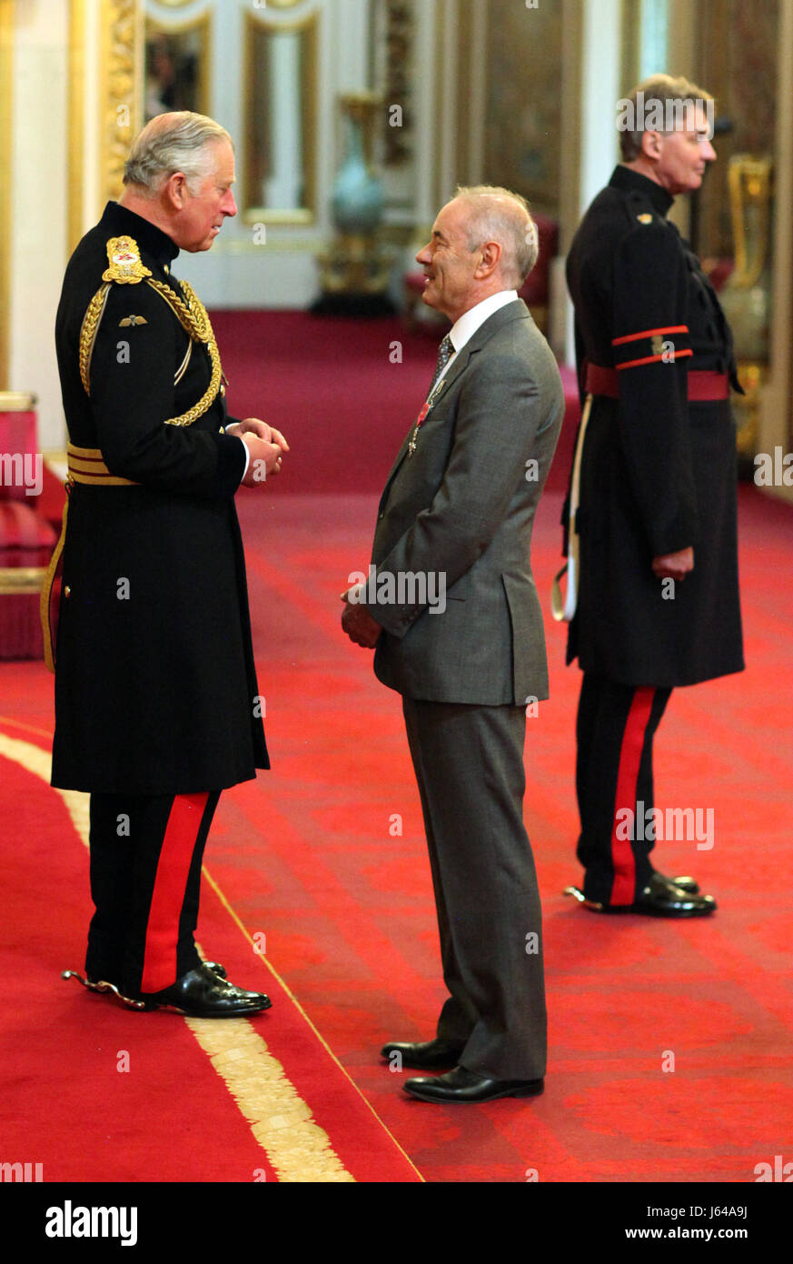 Robert Woods is made an MBE by the Prince of Wales during an ...