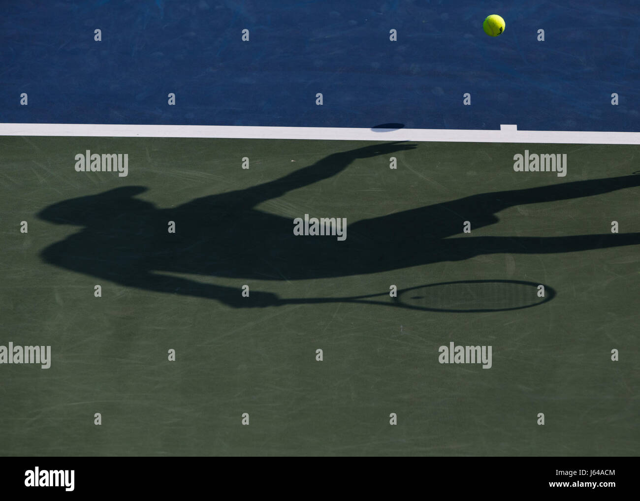 Shadow of tennis player Stock Photo - Alamy
