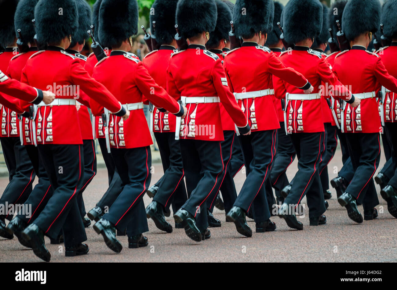 Soldiers in classic red coats march along The Mall in London, England ...